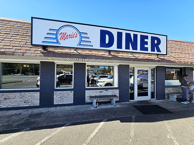 Marie's Diner's clean blue-and-stone facade might look unassuming, but inside lurks breakfast magic that would make your cardiologist nervous.