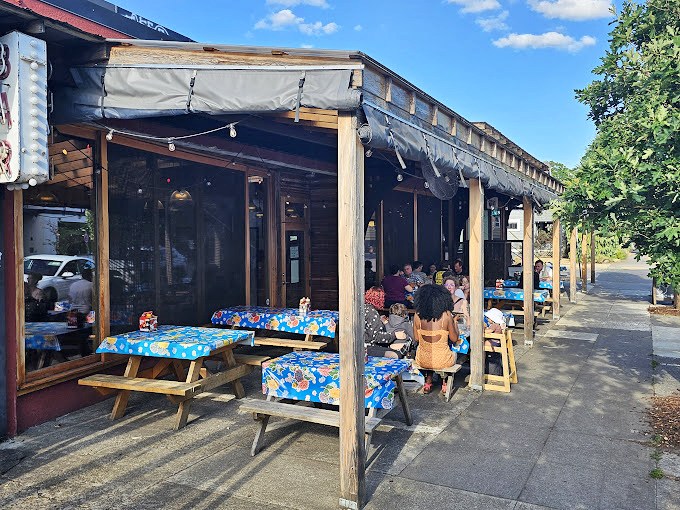 Window signs that cut to the chase: BRISKET, RIBS, PORK. It's like poetry for hungry people with priorities straight.