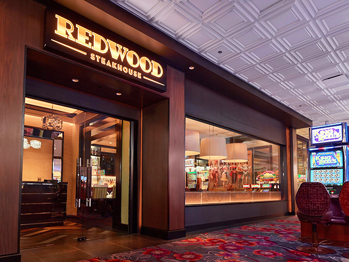 Redwood Steakhouse's elegant entrance is like finding an oasis of culinary sophistication amid the casino chaos. Your taste buds will thank you.