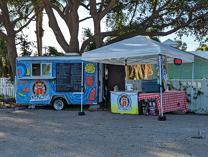 The Dog Pound's electric blue food truck glows like a hot dog spaceship that's landed to save us from boring lunches.