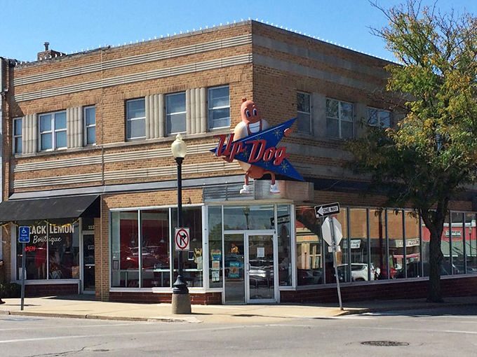 That vintage neon sign isn't just advertising&mdash;it's a beacon of hope for weary travelers seeking hot dog nirvana.