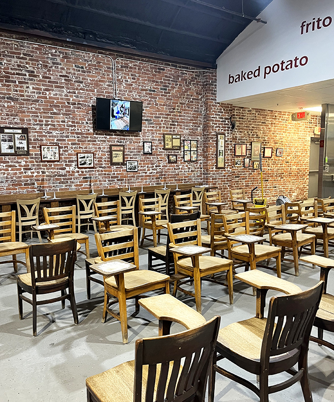 Wooden chairs await patrons like silent witnesses to decades of delicious decisions in this temple of tubular meat perfection.