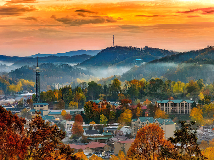 The Smoky Mountains play peek-a-boo with Gatlinburg through the morning mist, creating nature's own theatrical reveal.