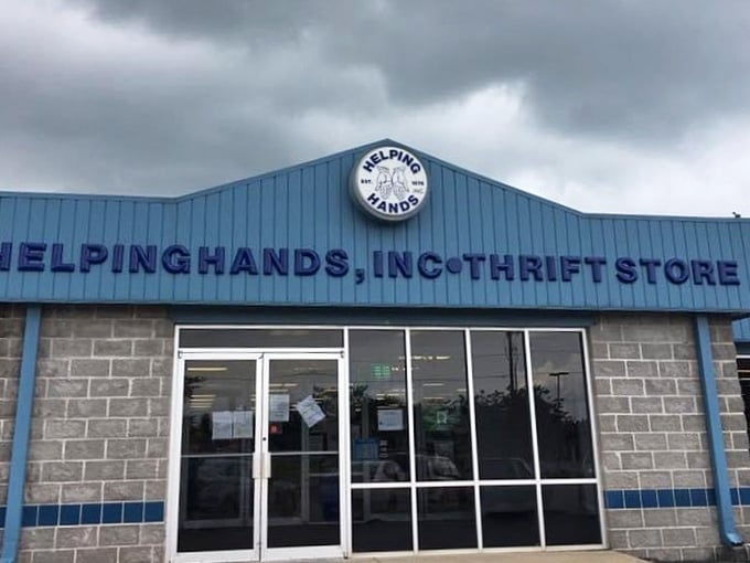 Even under moody skies, Helping Hands' distinctive blue building stands out like a beacon for thrift enthusiasts seeking quality finds.
