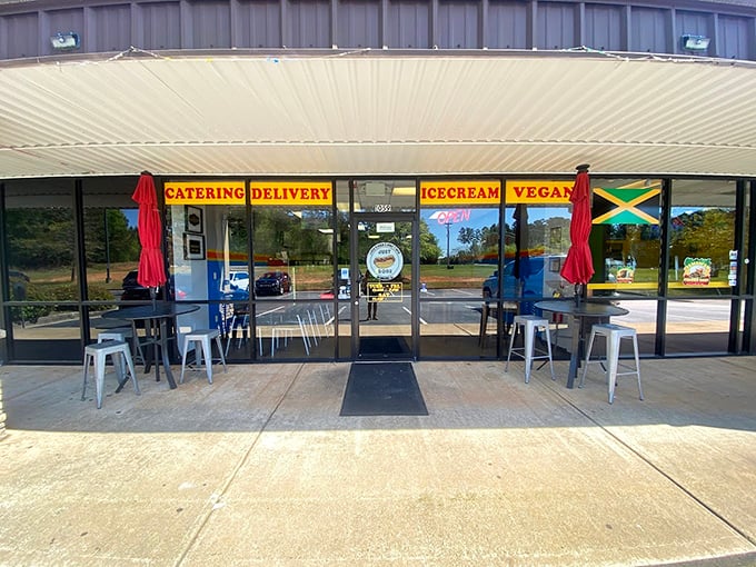 Where metal stools and Jamaica-inspired flavors create an unexpected hot dog symphony in a suburban strip mall setting.