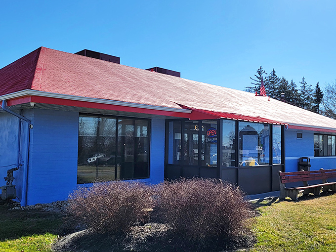 The diner that understood color therapy before it was trendy: red roof for appetite, blue walls for calm satisfaction.