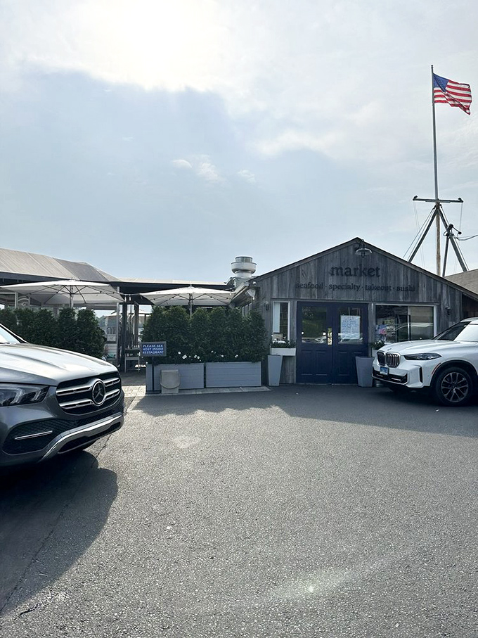 The American flag stands guard over Rowayton's seafood treasures, while luxury cars hint that even the well-heeled can't resist simple pleasures.