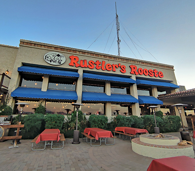 The blue awnings of beef paradise. Come for the view, stay for the steaks that make vegetarians question their life choices.