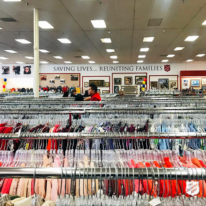 A sea of hangers stretches to the horizon, each holding someone's past ready to become your future. Color-coded for the serious bargain hunter.