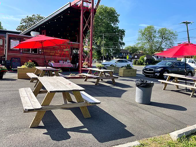 Outdoor dining doesn't get more authentic than this. Uncle John's red truck and wooden tables create a backyard BBQ vibe minus the cleanup.