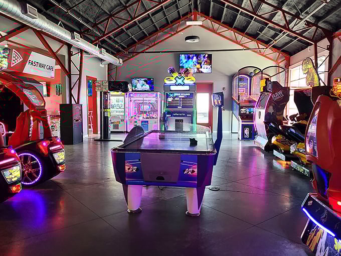 Between adrenaline rushes, the arcade offers a different kind of competition. Air hockey battles have settled more family feuds than any court of law.