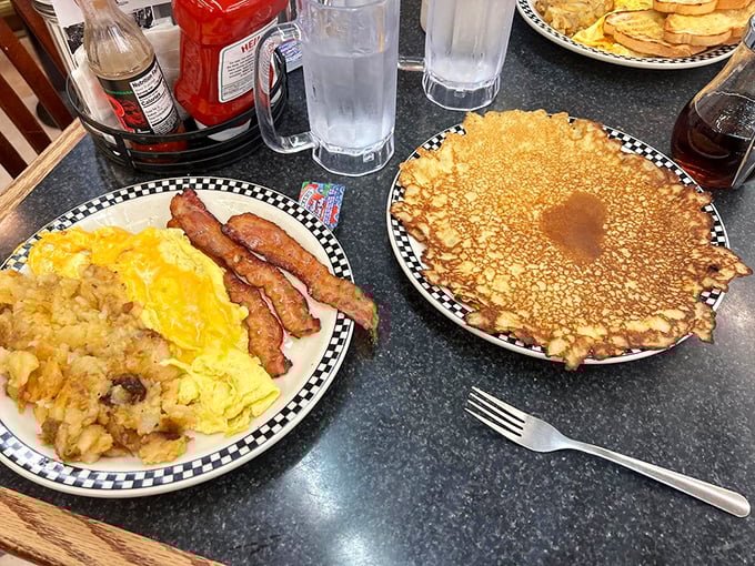 Sunny-side eggs and home fries smothered in cheese &ndash; proof that sometimes the simplest breakfast combinations create the most profound happiness.