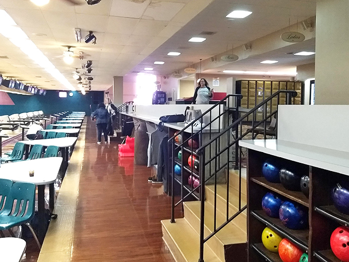 The rack of colorful bowling balls waits patiently, each one holding the promise of a strike or the secret to your next great bowling story.
