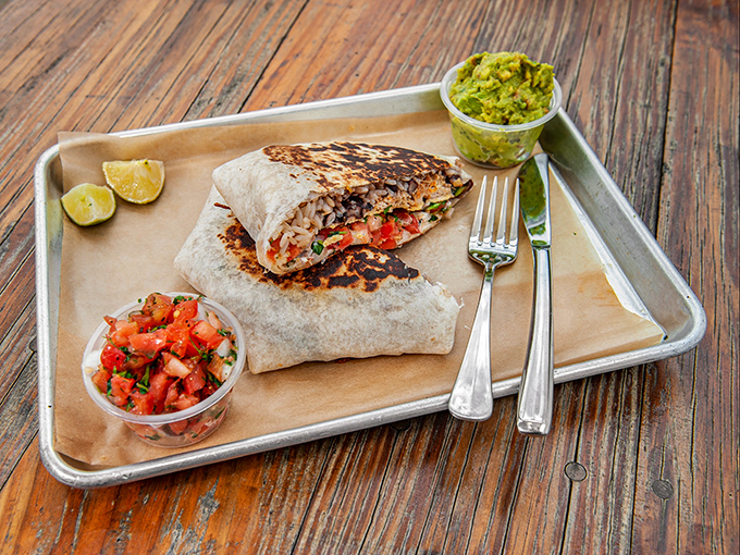 This isn't just breakfast wrapped in a tortilla&mdash;it's morning salvation with perfectly charred edges and fresh accompaniments that demand a moment of silent appreciation.