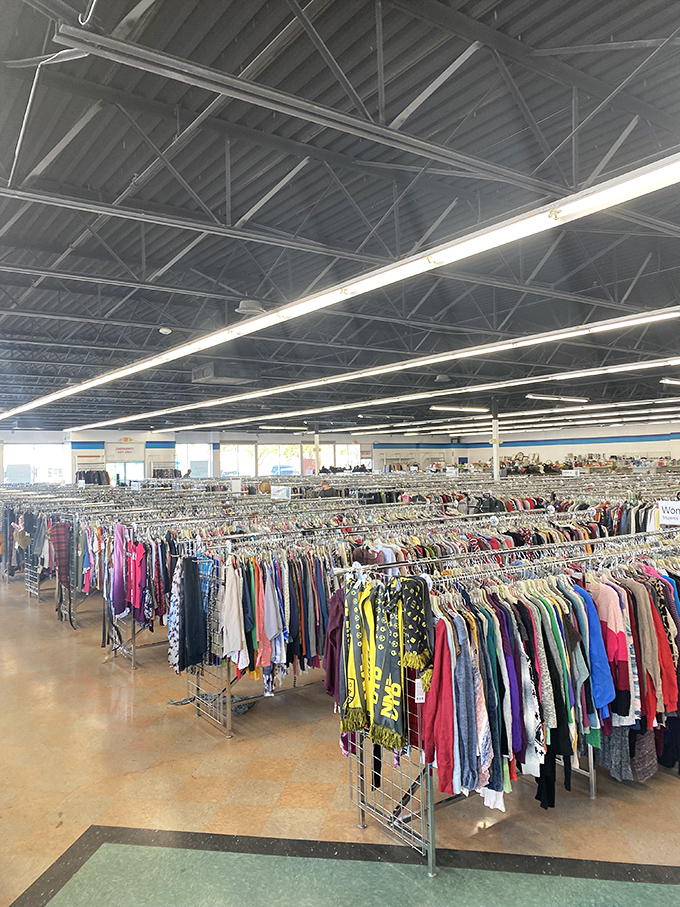 A sea of garments arranged with military precision. Each rack contains someone's perfect find hiding in plain sight.