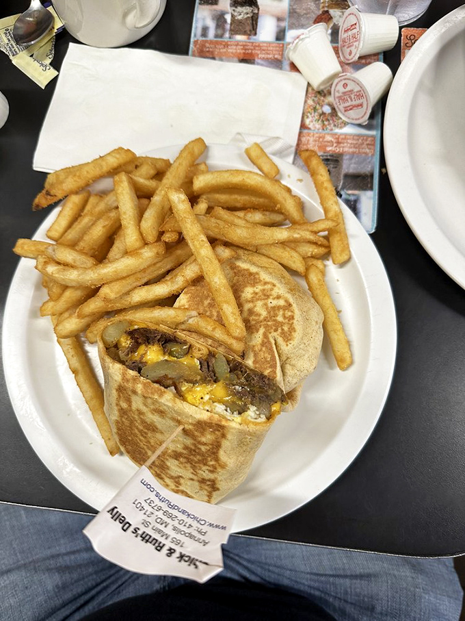 Breakfast that requires engineering skills to eat. This wrap-and-fries combo could fuel a midshipman through calculus and calisthenics.