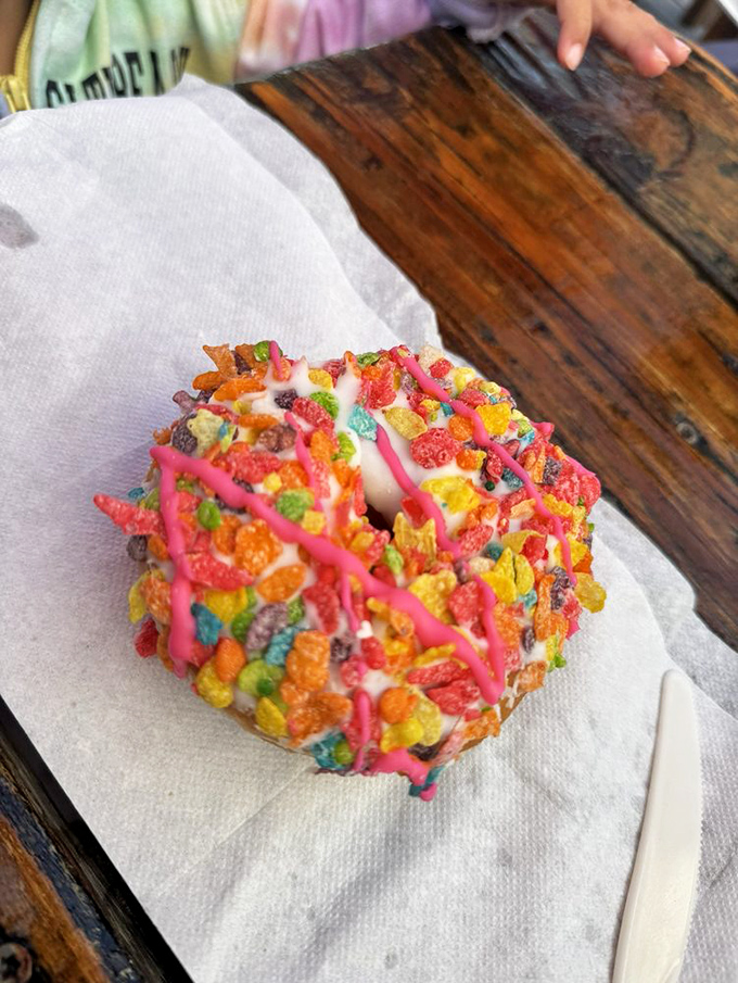 Fruit Loop donut: where childhood breakfast cereal meets adult indulgence. The pink drizzle is just showing off.