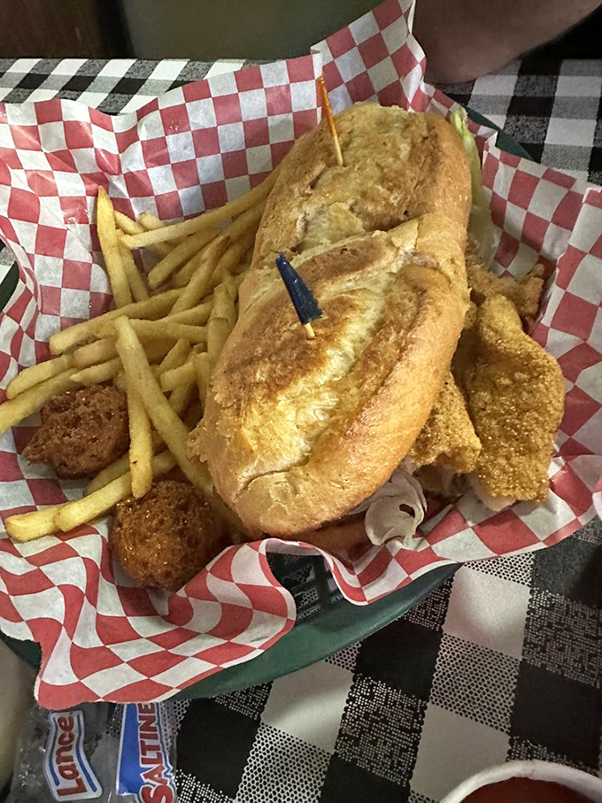 Behold the sandwich that launched a thousand road trips. This grouper poor boy demands a moment of reverent silence before the first magnificent bite.