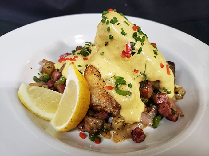 This isn't just fish&mdash;it's culinary architecture. Grilled speckled trout perched atop a colorful hash, crowned with hollandaise that cascades like a buttery waterfall.
