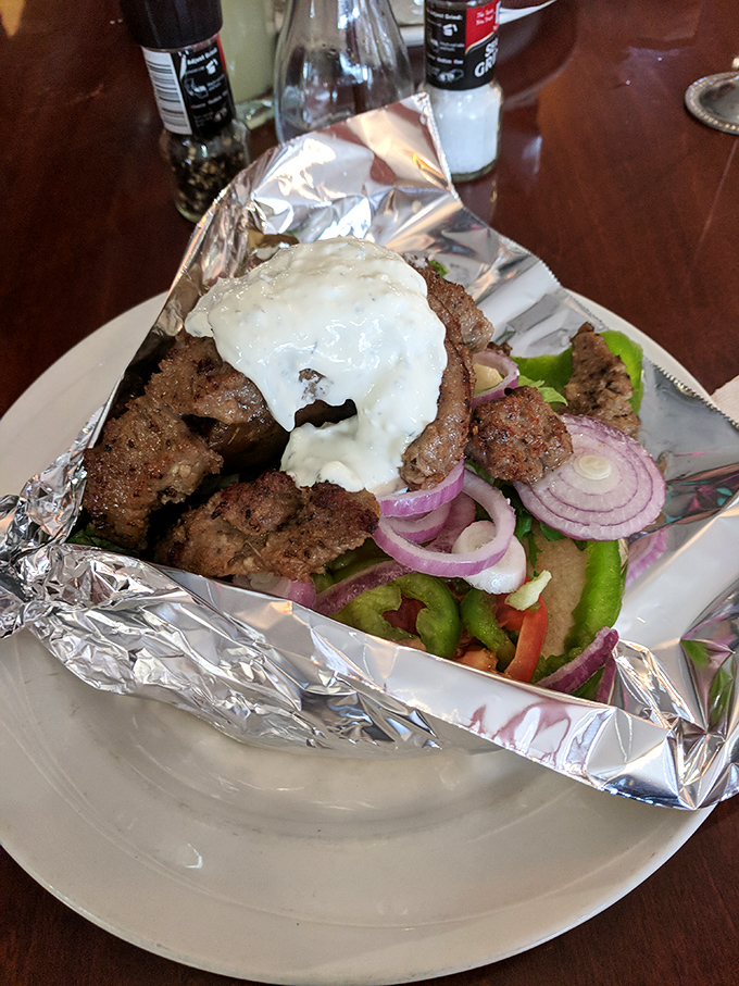 This isn't just a gyro&mdash;it's a masterclass in the art of perfect meat-to-sauce ratio. That tzatziki cascade is what dreams are made of.