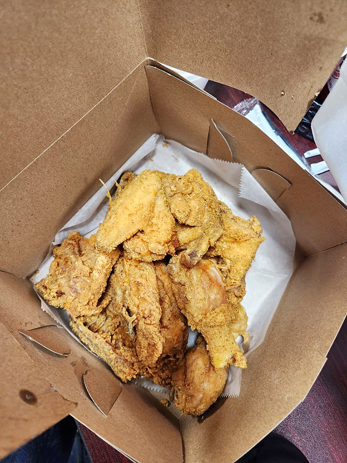 Golden-brown perfection in a box. This chicken doesn't need fancy packaging when it's dressed in a crust that crackles like nature's finest symphony.
