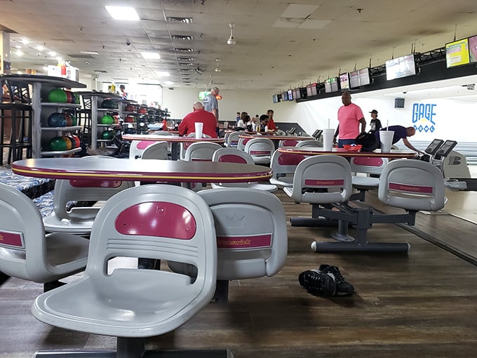 League night brings out the regulars, their personalized bowling balls waiting patiently on racks while friendly competition fills the air.