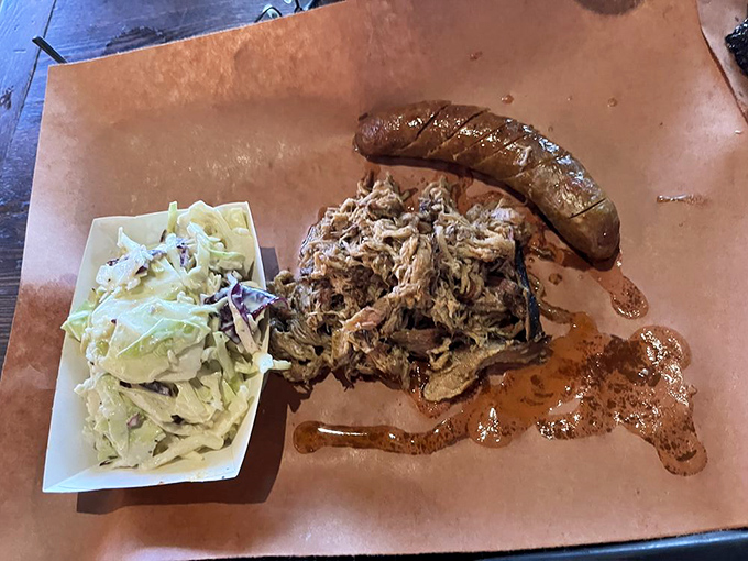 That pulled pork looks so tender it practically surrendered to the smoker, while the sausage stands guard like a delicious sentinel.