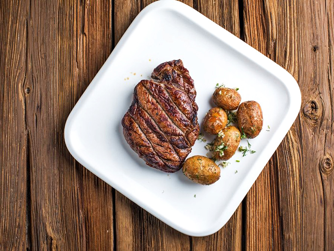 This steak doesn't need Instagram filters – it's living its best life with those potatoes. The thin-sliced herbs add freshness that says, "I'm not just a pretty plate."
