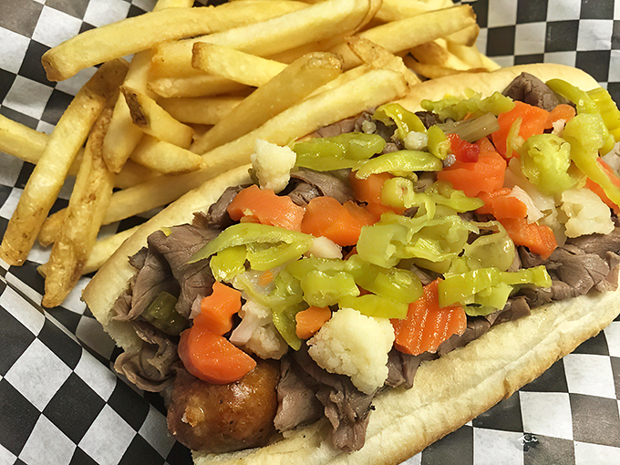 This isn't just a sandwich; it's architecture &ndash; layers of tender beef supporting a perfect balance of peppers, with fries standing guard alongside.