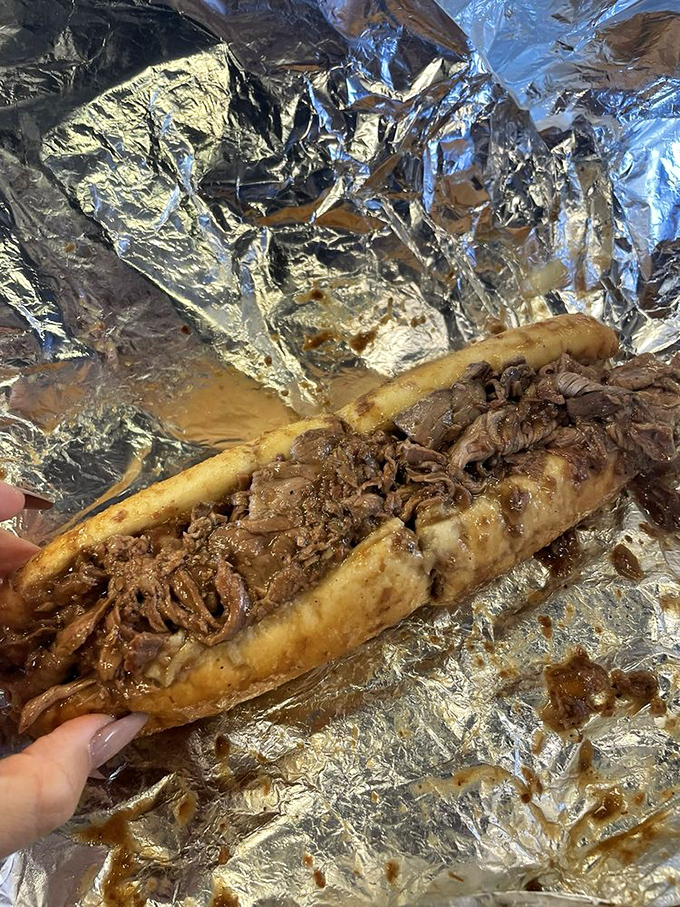 Meat poetry wrapped in foil. The roast beef glistens with juices that will soon require a strategic napkin deployment plan.