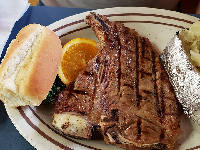 This T-bone doesn't just arrive at your table&mdash;it makes an entrance, flanked by a foil-wrapped potato like a heavyweight champion with its trusty cornerman.
