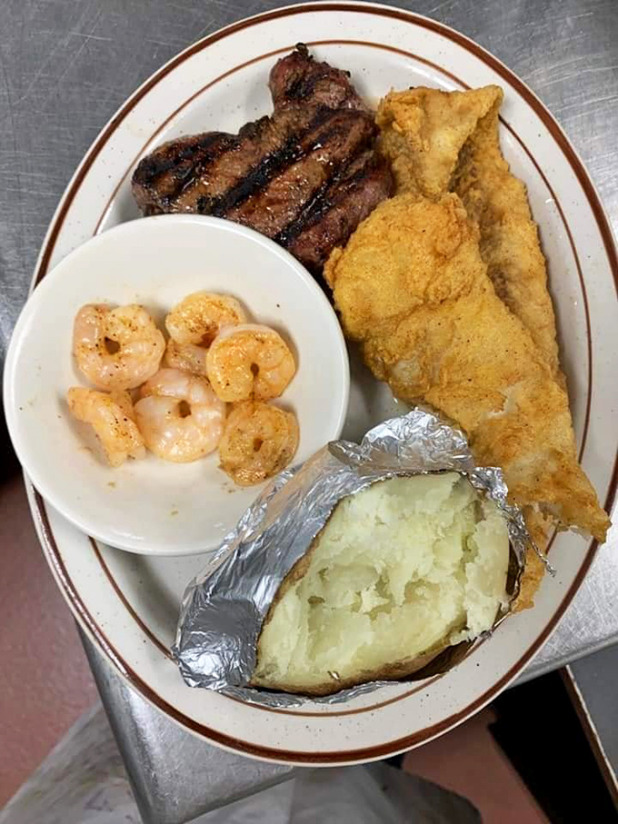 The holy trinity of Midwestern indulgence: perfectly seared steak, golden-battered fish, and plump shrimp that would make Neptune himself jealous.