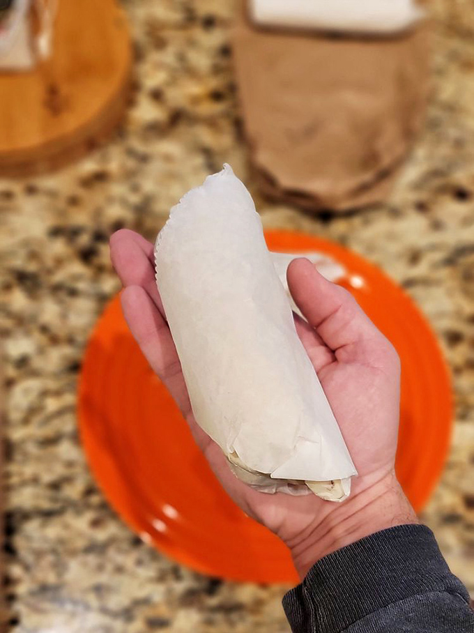 Simplicity wrapped in flour&mdash;this white-wrapped wonder holds the key to breakfast bliss, sitting proudly on its bright orange throne.