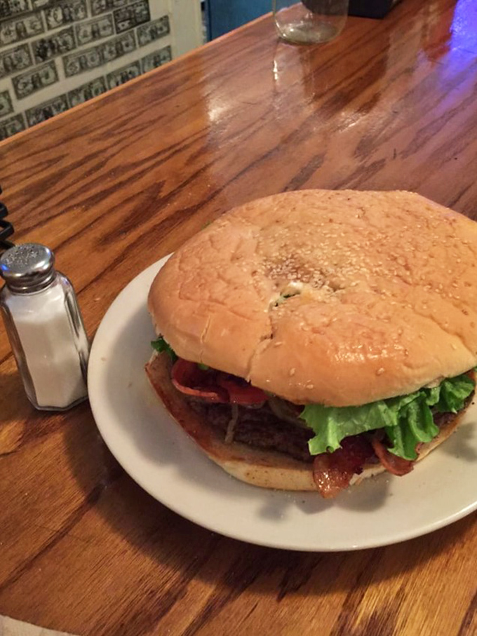 This isn't just a burger; it's a commitment. The bacon cheeseburger arrives with a presence that commands respect and elastic waistbands.