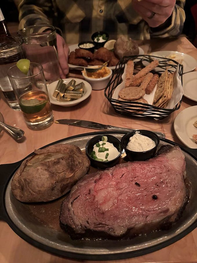 Heaven on a plate&mdash;prime rib so perfectly cooked it makes you question why you've ever ordered anything else. The baked potato stands proudly alongside.