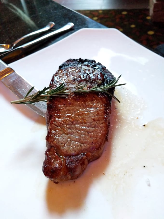 This isn't just a steak; it's a sermon on simplicity. One perfect cut, a sprig of rosemary, and beef that speaks for itself.