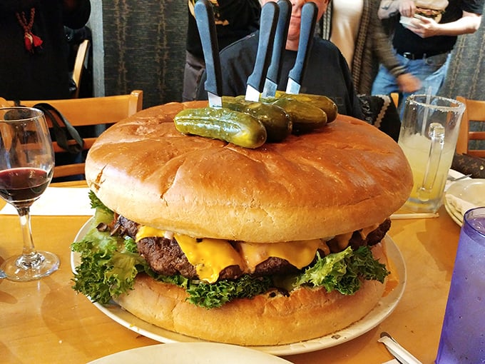 Not so much a burger as a culinary skyscraper &ndash; this three-pounder comes with pickles on top like tiny flagpoles claiming victory over your appetite.
