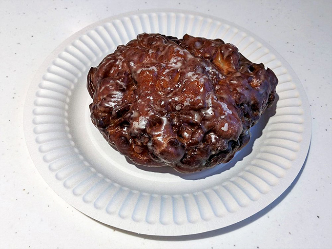 This isn't just an apple fritter; it's edible architecture&mdash;a masterpiece of caramelized crust, tender interior, and apple-cinnamon magic.