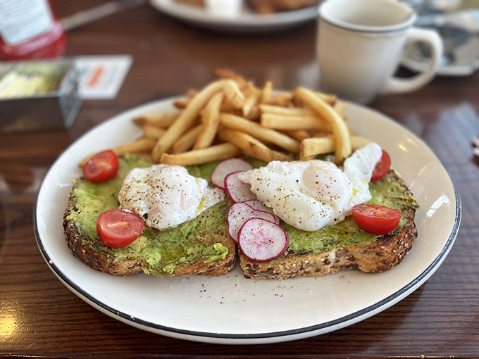 Avocado toast that actually justifies the millennial obsession. Those perfectly poached eggs perched on top are doing a balancing act worthy of Cirque du Soleil.