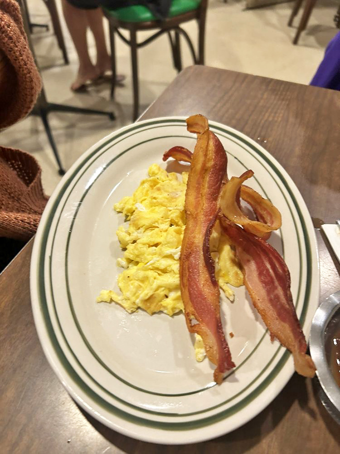 Scrambled eggs so fluffy they could float away if not anchored by that magnificent bacon &ndash; thick-cut and perfectly crisped to breakfast perfection.