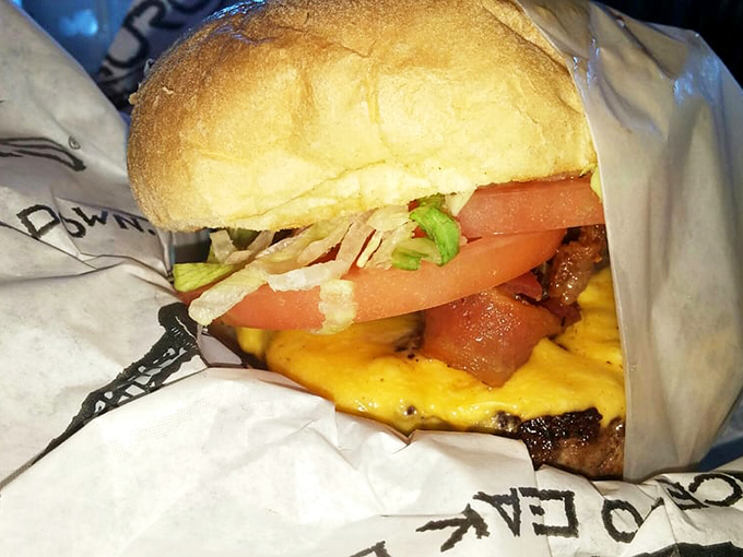 This isn't just a burger—it's a masterpiece of melted cheese cascading over a perfectly charred patty. Architecture never tasted so good.