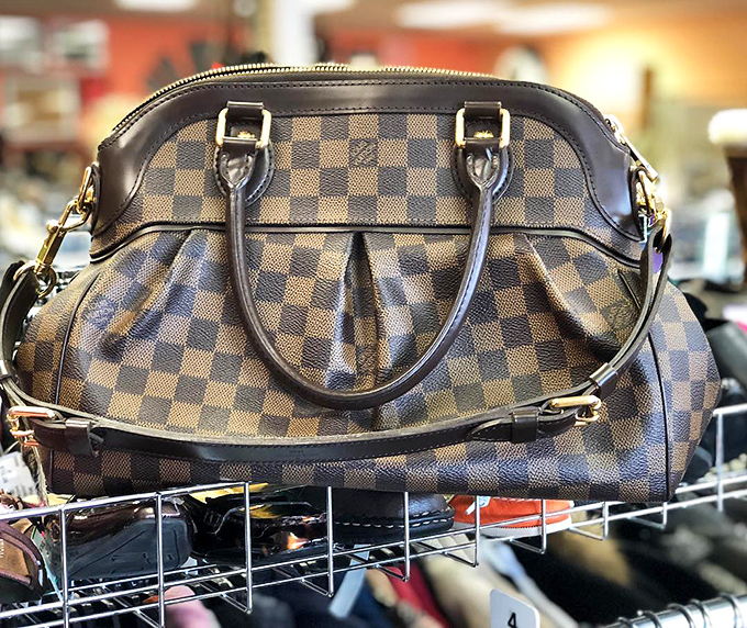 Designer dreams don't die; they just relocate to Shawnee. This Louis Vuitton bag found sanctuary among fellow fashion refugees.