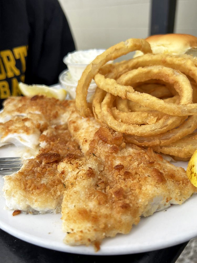 Baked haddock so fresh you'd swear it jumped from ocean to plate, with onion rings that could double as delicious golden bracelets.