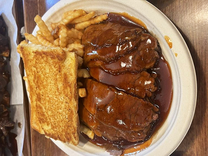 Brisket so tender it practically surrenders before your fork even touches it. That sauce isn't hiding anything—it's celebrating what's underneath.