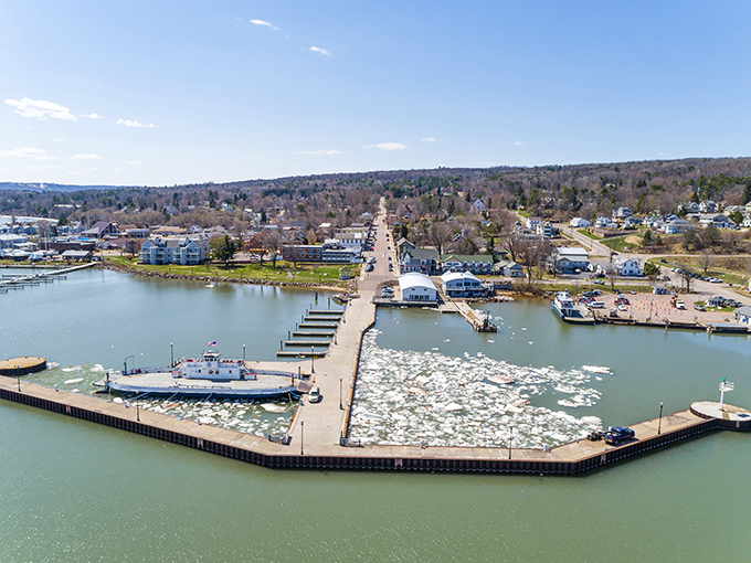 Winter transforms Bayfield's harbor into a dramatic ice kingdom where ferries carve paths through frozen waters like aquatic snowplows.