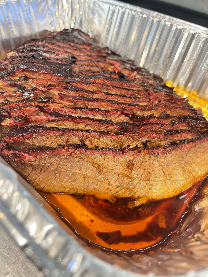 Behold the brisket in all its glory&mdash;that smoke ring is like nature's way of saying "you're welcome." The bark on this beauty would make a redwood jealous.