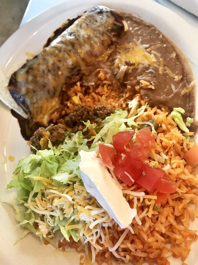 Not all enchiladas wear capes, but this one deserves superhero status with its rich mole sauce cloaking tender meat and melty cheese.