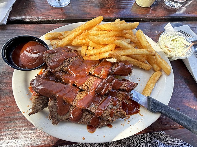 Roast beef so perfectly pink it makes you wonder if bovine heaven is missing an angel, served alongside golden fries and tangy sauce.