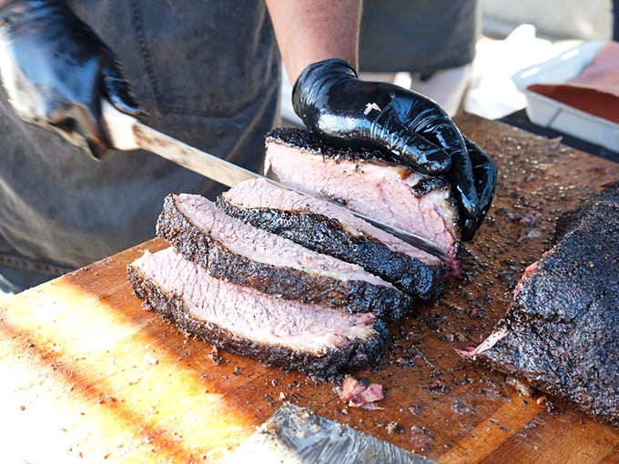 The sacred ritual of brisket slicing &ndash; where that knife reveals the pink smoke ring that separates the barbecue masters from the merely ambitious.