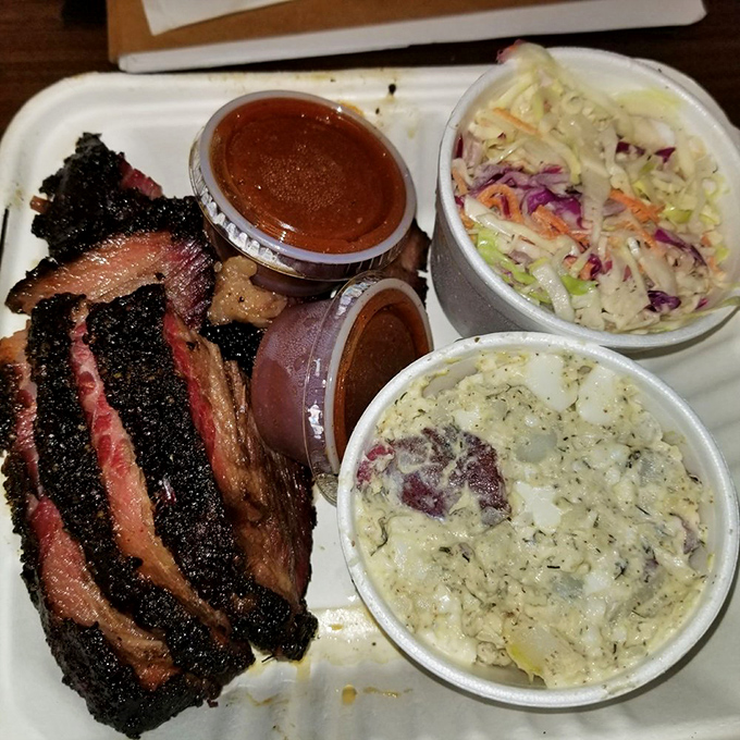 Brisket with that coveted pink smoke ring sitting alongside creamy potato salad and crisp slaw&mdash;the holy trinity of barbecue plates that would make even a Texan nod approvingly.